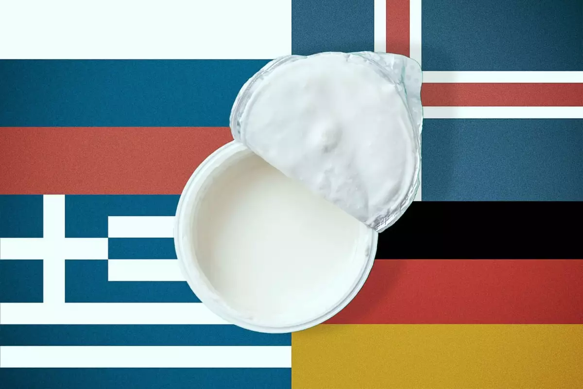 Lau bandera nazional ezberdinen gainean jarritako jogurt bat.