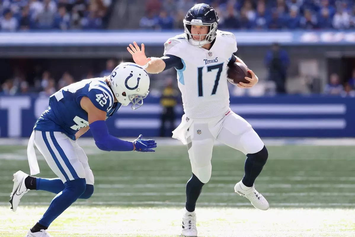 Ο Ryan Tannehill με άκαμπτα χέρια Andrew Sendejo των Indianapolis Colts